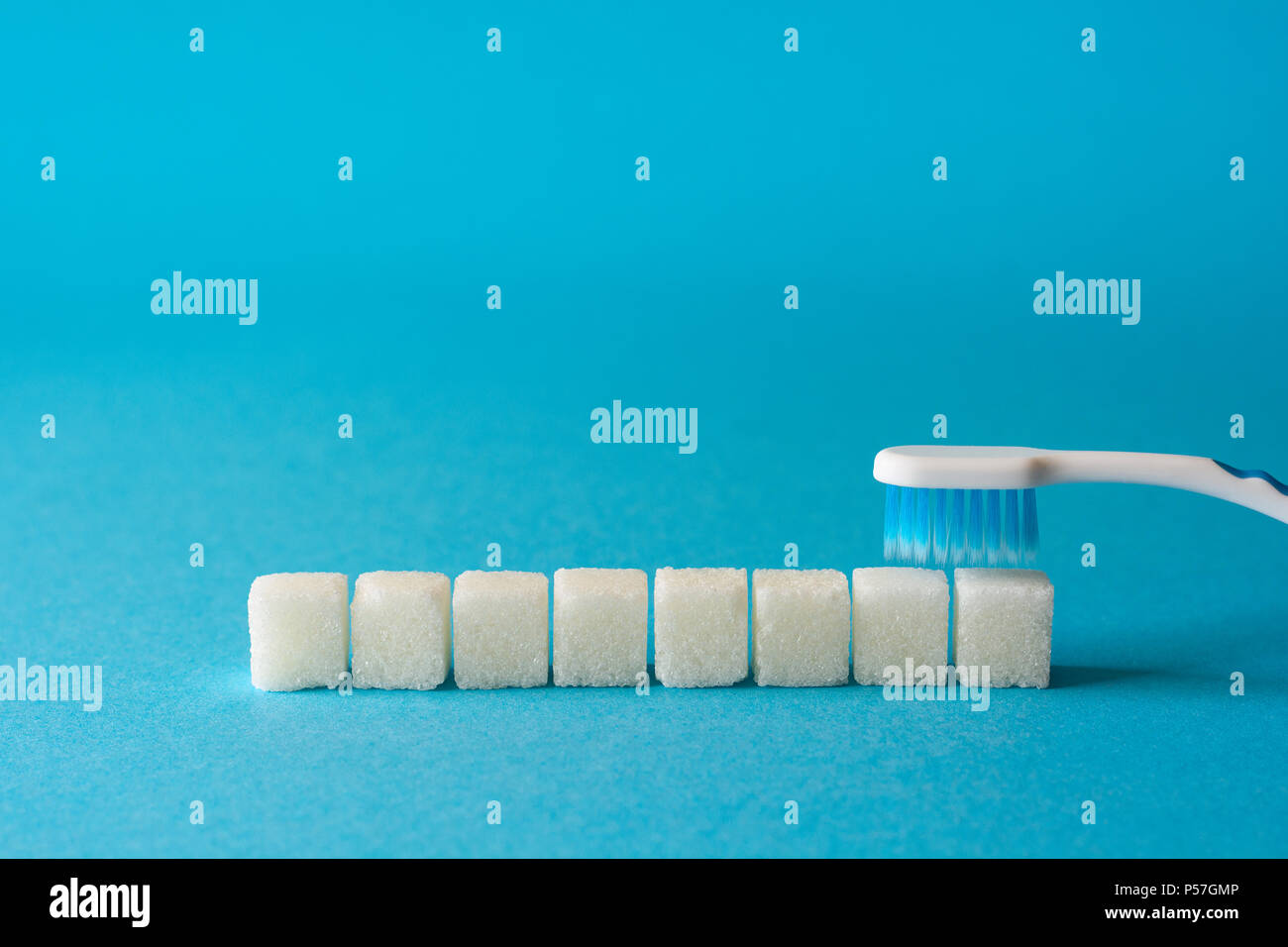 Brushing teeth. Toothbrush cleans dirt from teeth. Sugar cubes and ...