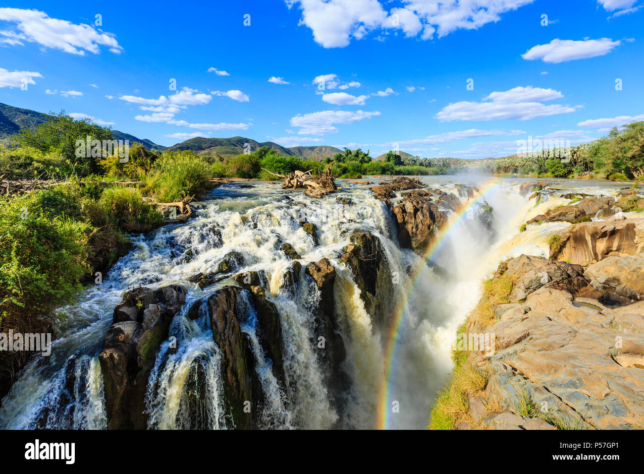 Rainbow over waterfall, Epupa Falls, Kunene region, Kaokoveld, Namibia ...