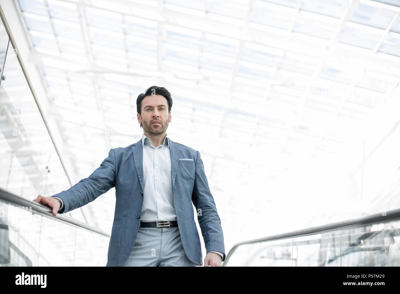successful young businessman at corporate location Stock Photo - Alamy