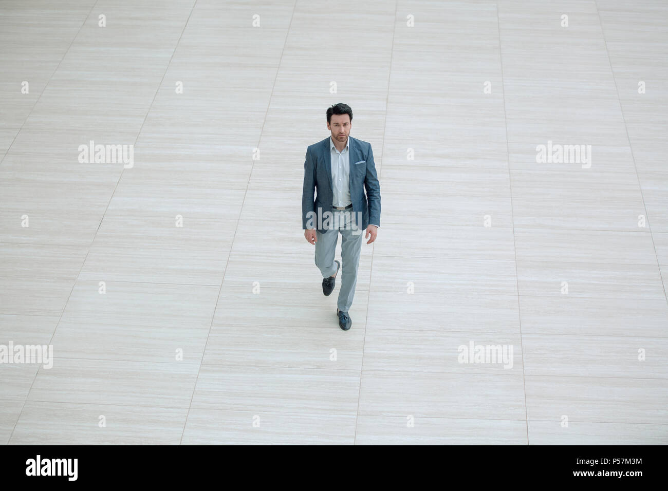Young white male walking confidently hi-res stock photography and ...