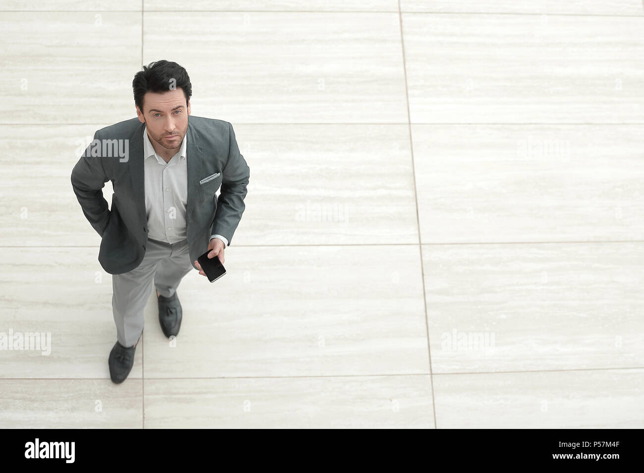 top view.businessman with smartphone looking at the camera Stock Photo ...