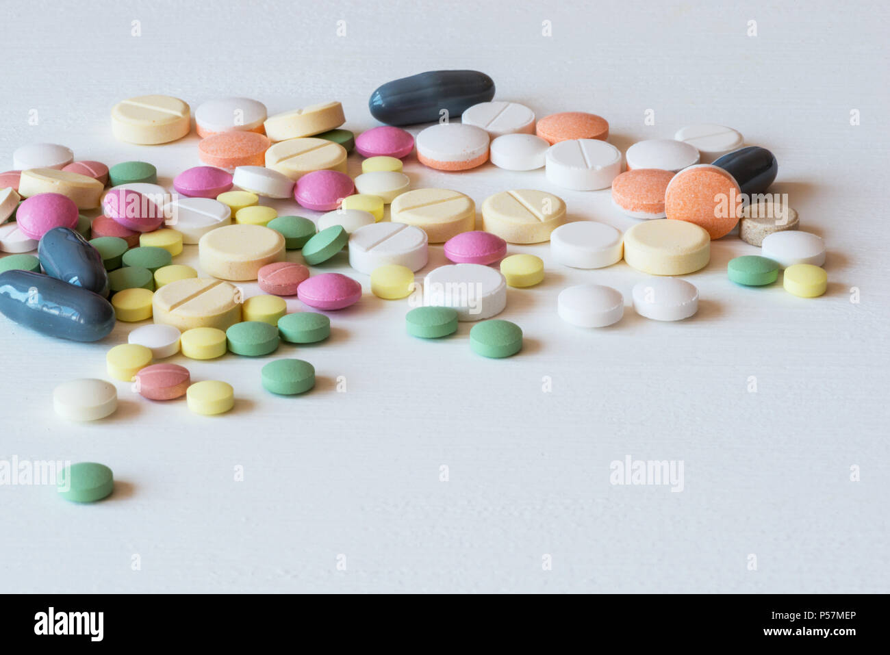 Different colorful medicines. Pills and capsules on white background ...