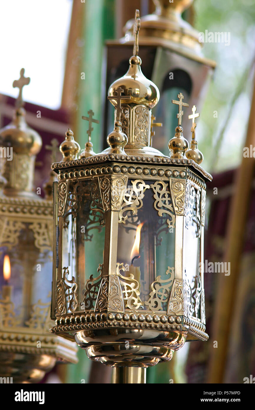 A gilded church lantern for a candle. Sacred service Stock Photo - Alamy