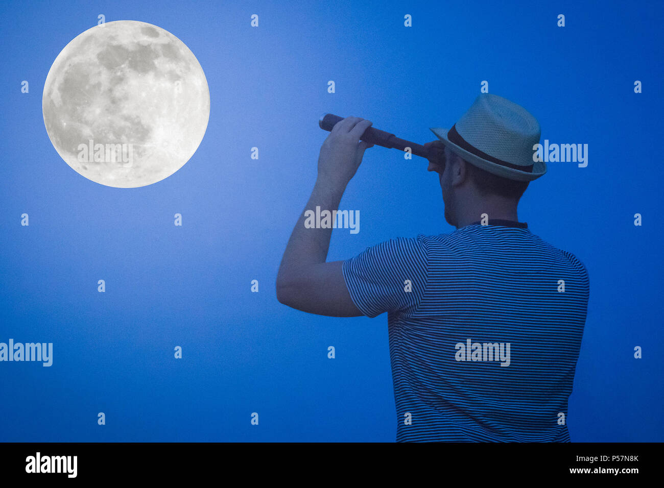 Man looking at moon spyglass hi-res stock photography and images - Alamy