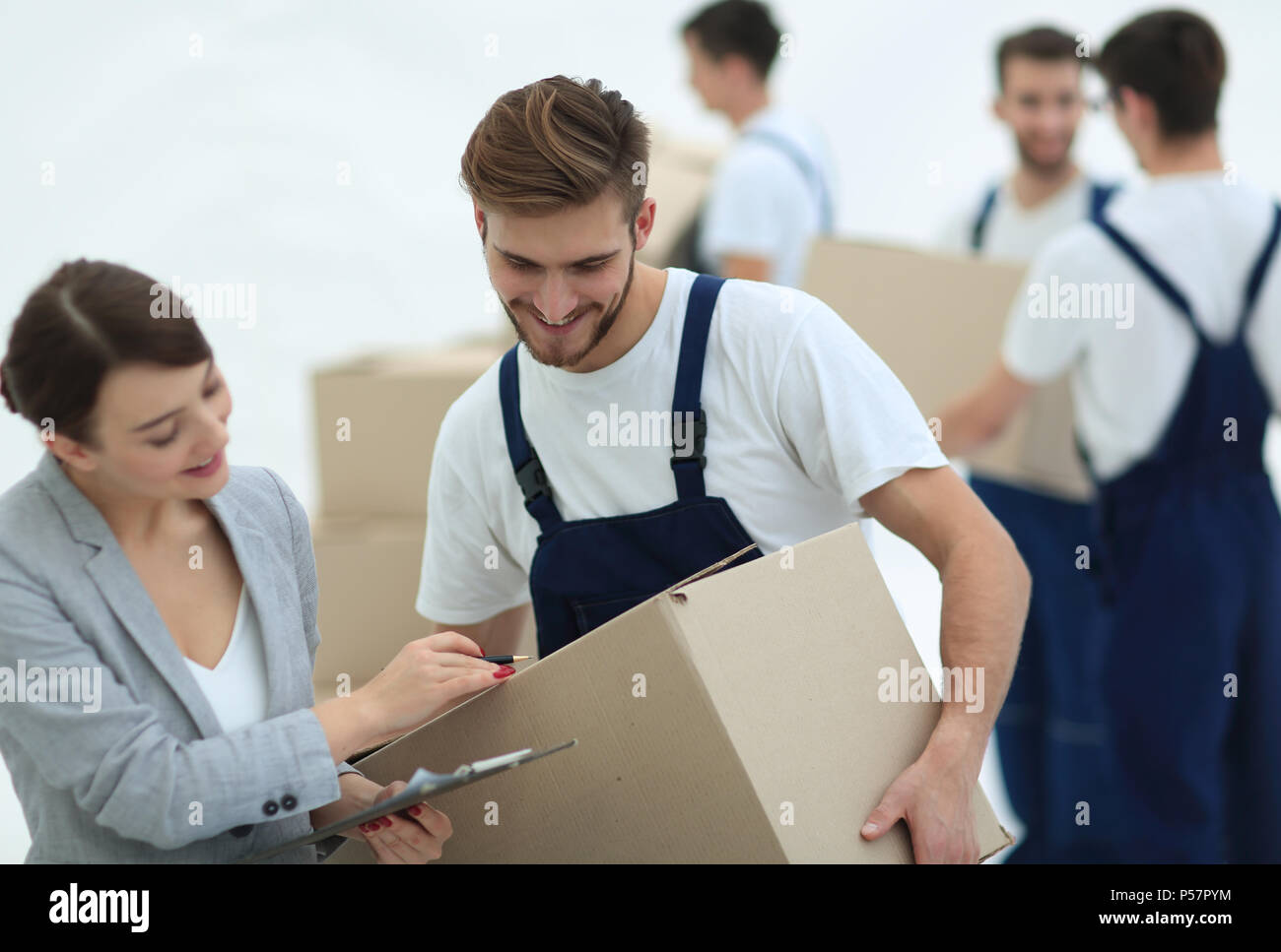 Manager and movers isolated on white background Stock Photo - Alamy