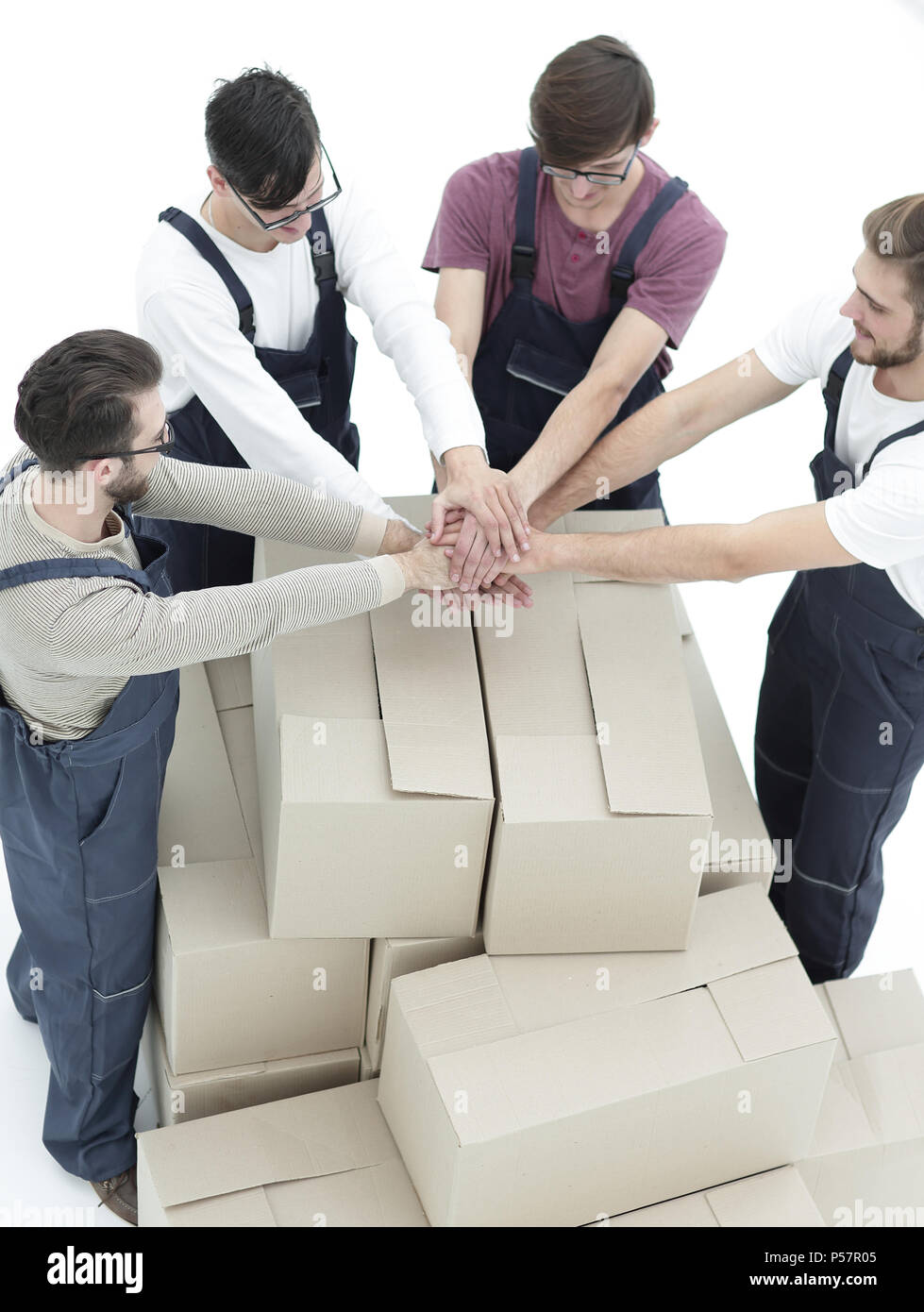Delivery men carrying stack of boxes. Isolated on white Stock Photo - Alamy