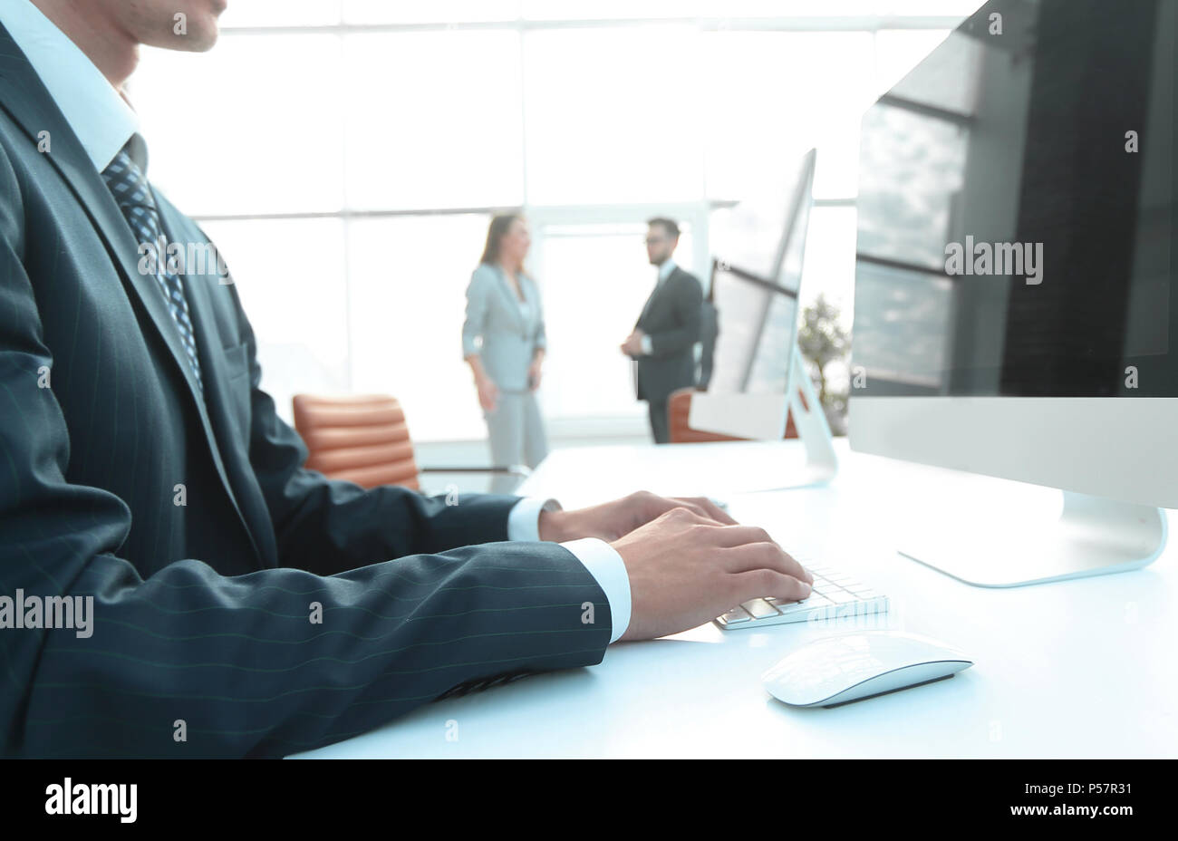 employee is typing on the computer keyboard Stock Photo - Alamy