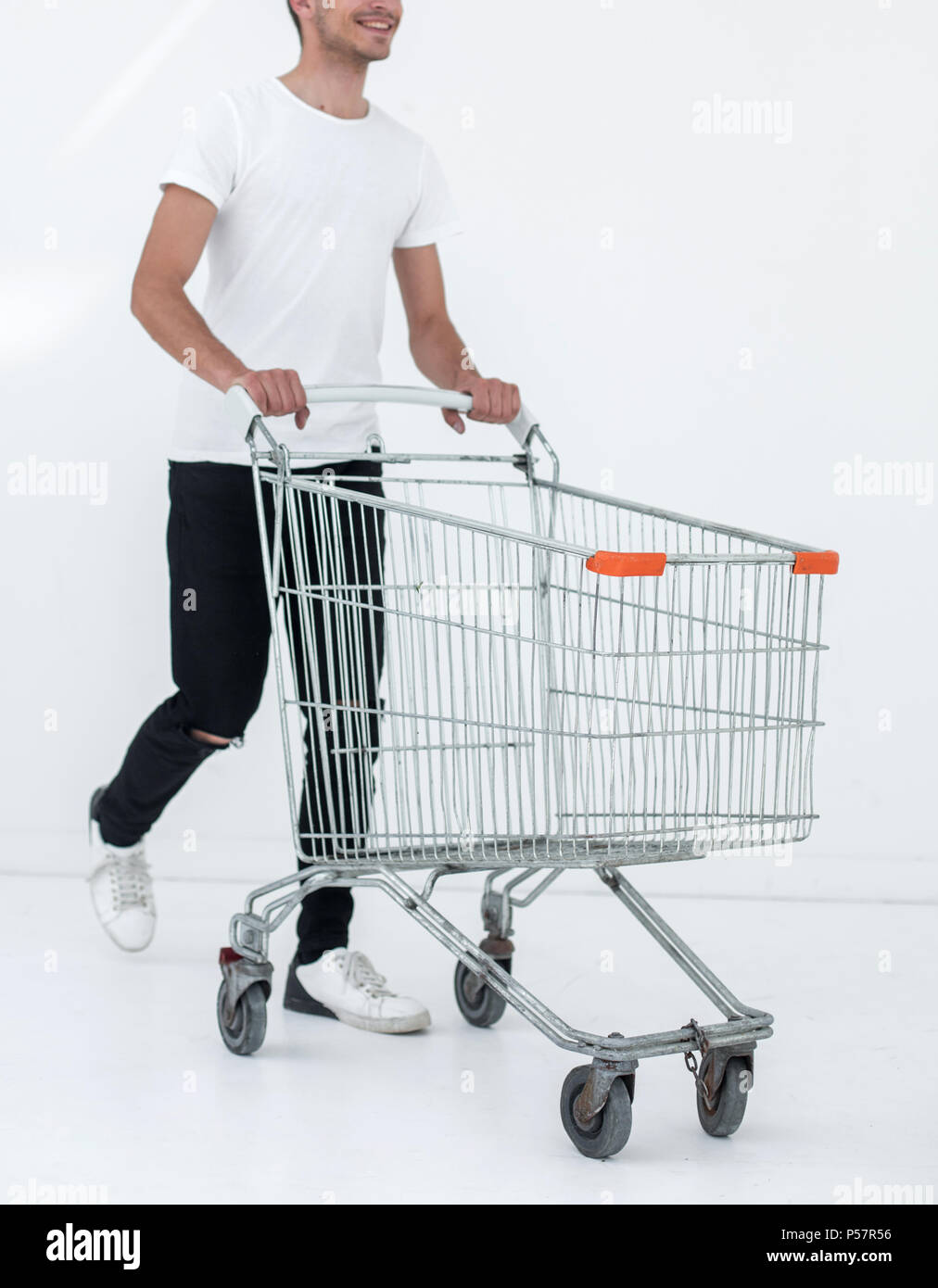 smiling man pushing shopping cart Stock Photo - Alamy