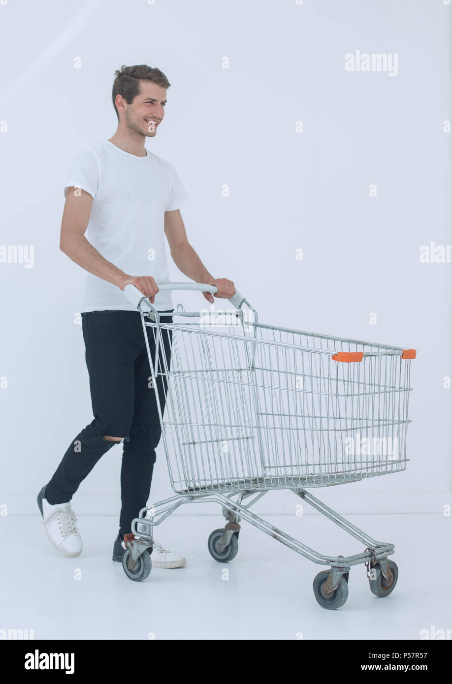 smiling man pushing shopping cart Stock Photo - Alamy