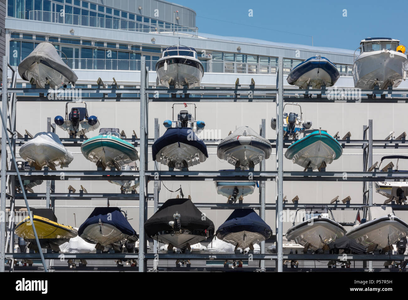 boats and ribs or rigid inflatable boats storage racks Stock Photo - Alamy