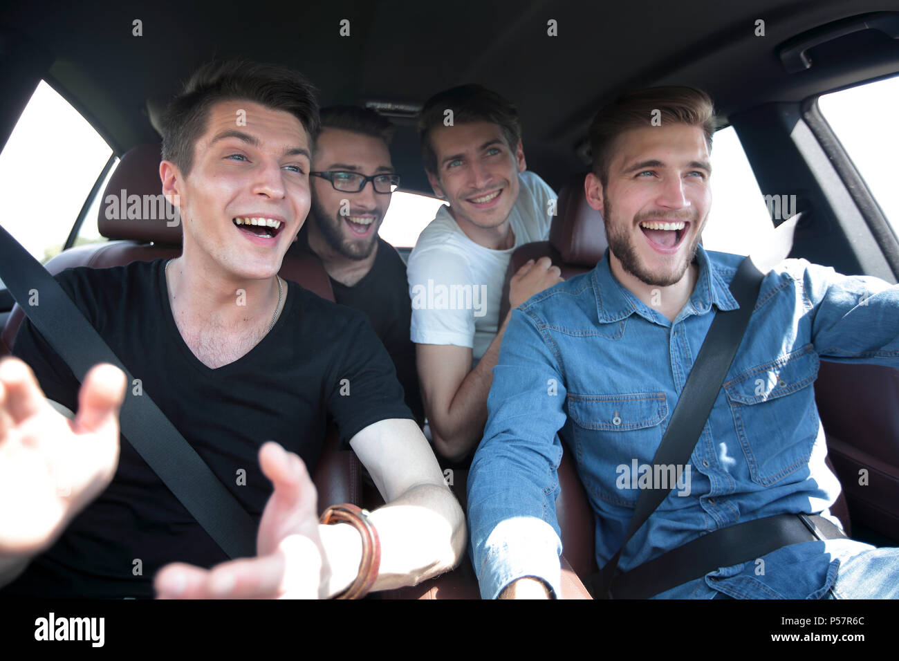 Three friends laughing in car hi-res stock photography and images - Alamy