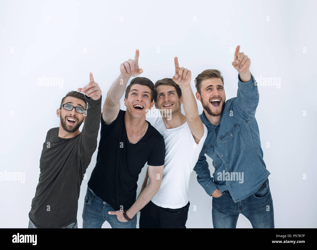 group of surprised young people looking and pointing up Stock Photo - Alamy