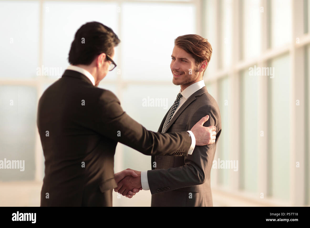 friendly handshake of business partners Stock Photo - Alamy