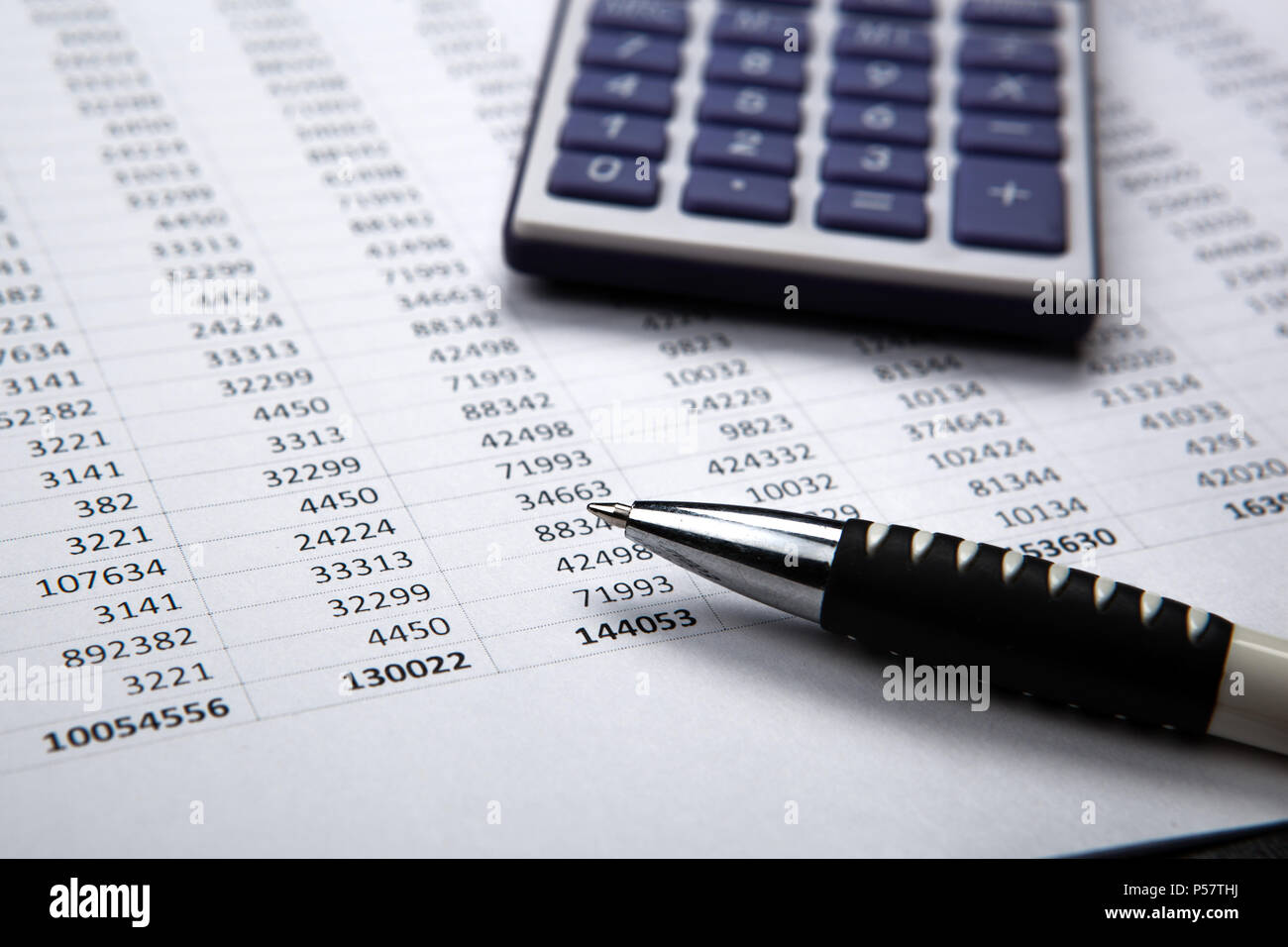 pen on background of calculator and accounting papers Stock Photo - Alamy