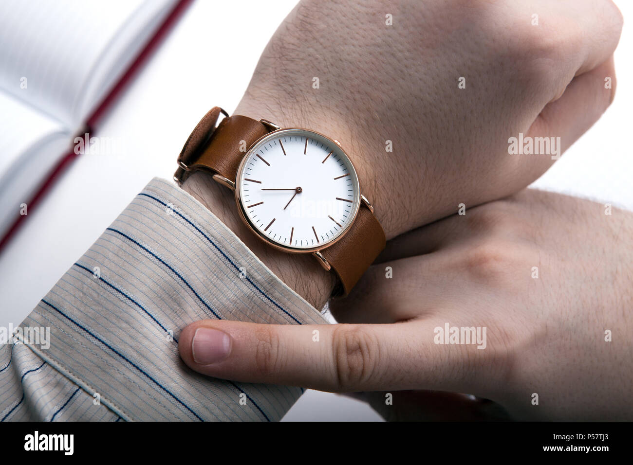 man looking at the time close up isolated Stock Photo - Alamy