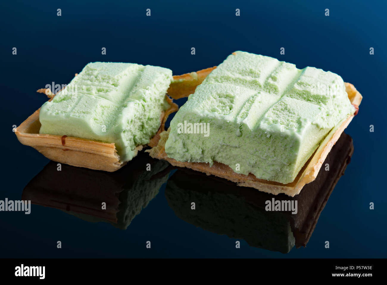 studio shoot of ice cream block on blue with reflection Stock Photo - Alamy
