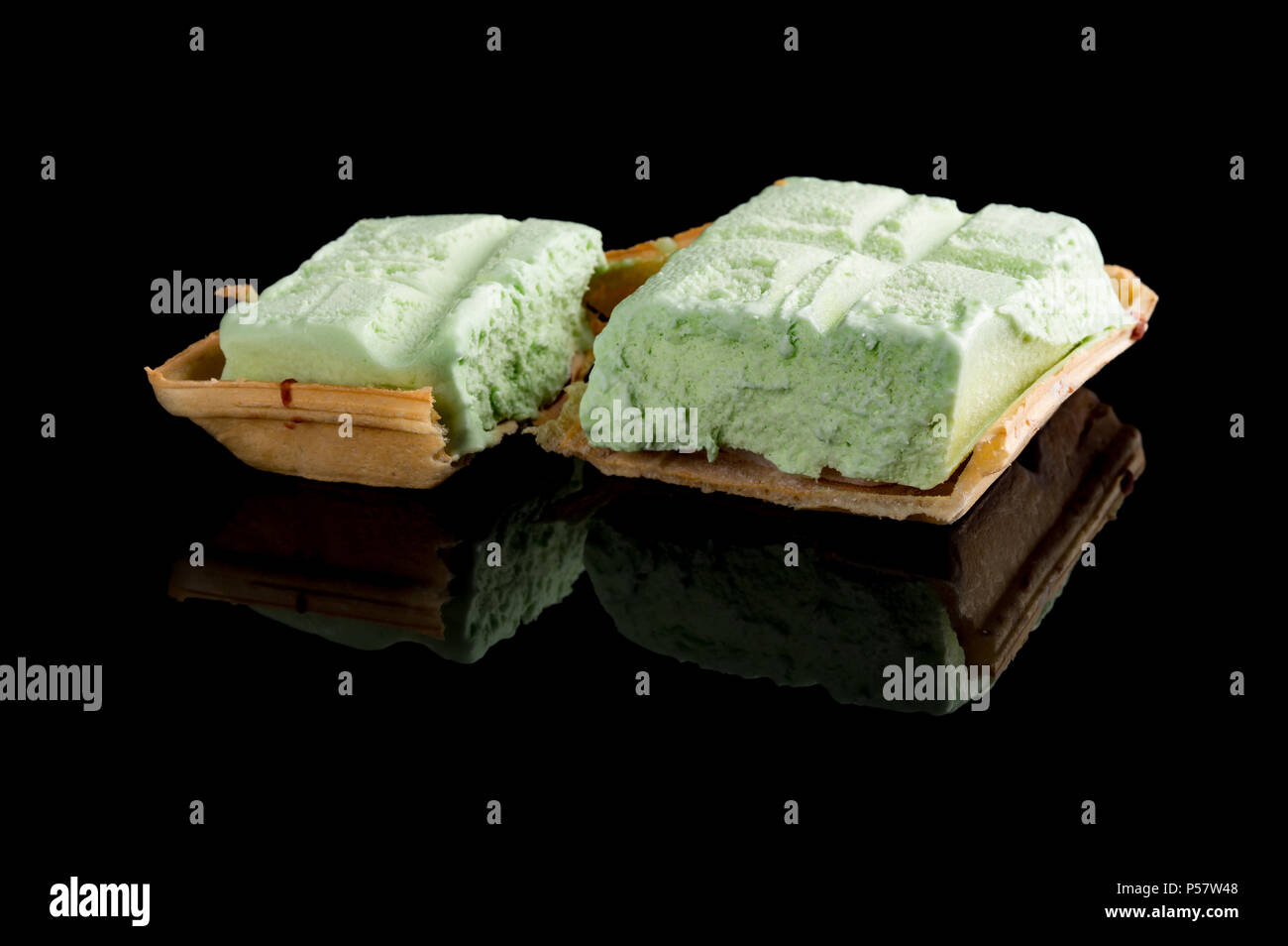 studio shoot of ice cream block on black with reflection Stock Photo ...