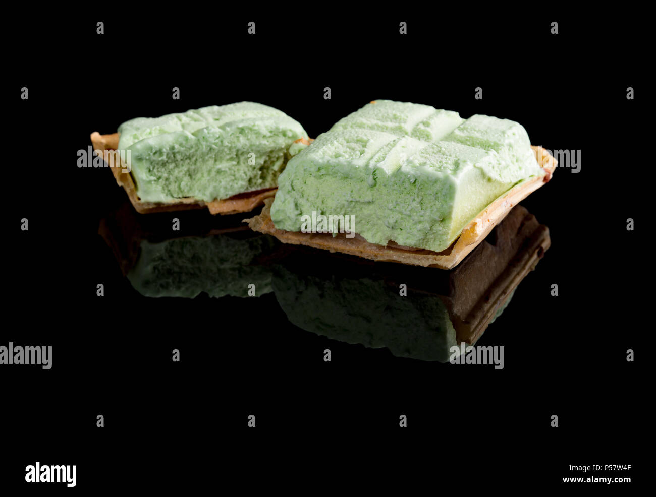 studio shoot of ice cream block on black with reflection Stock Photo ...