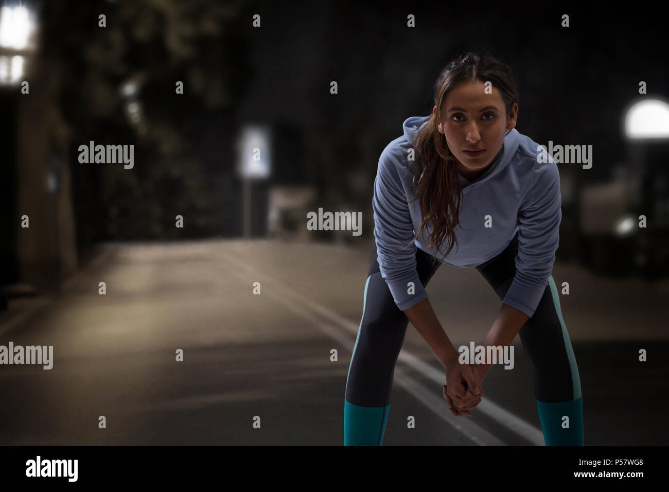 Woman runners running on road hi-res stock photography and images - Alamy
