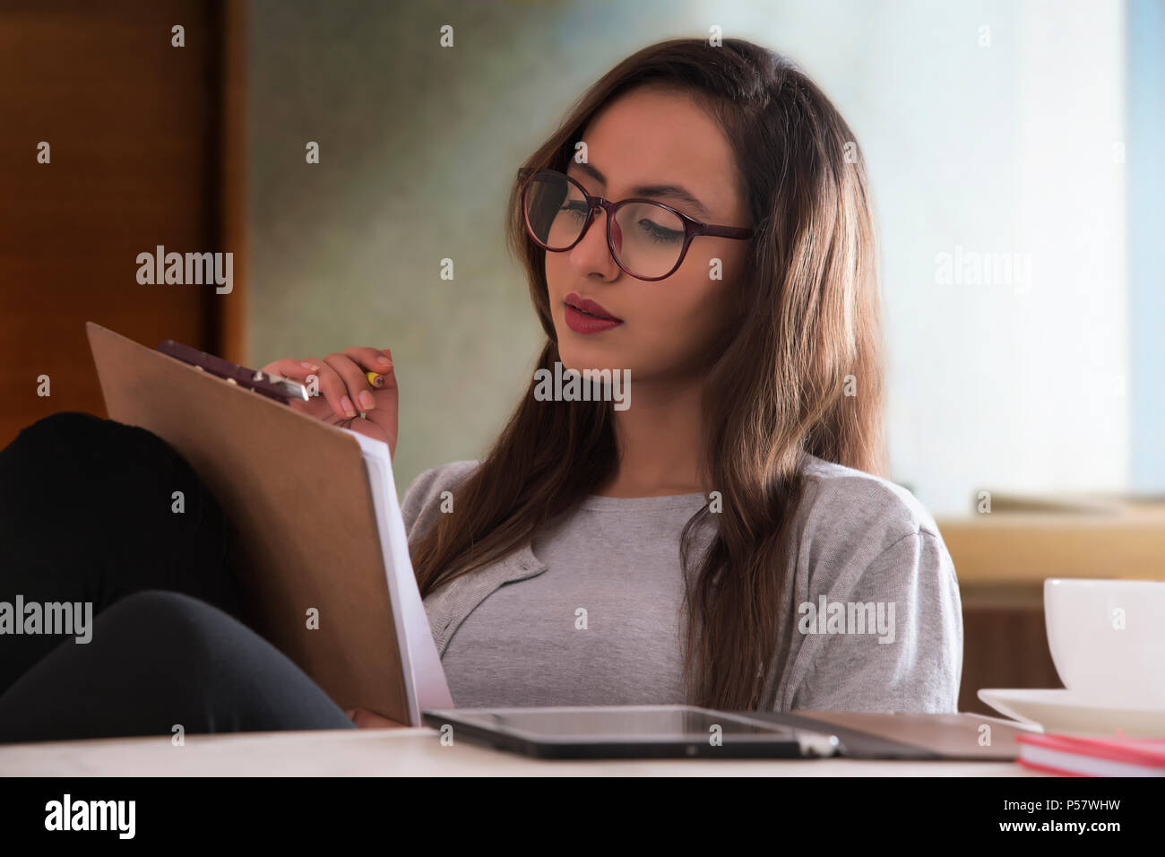 Indian women writing hi-res stock photography and images - Alamy