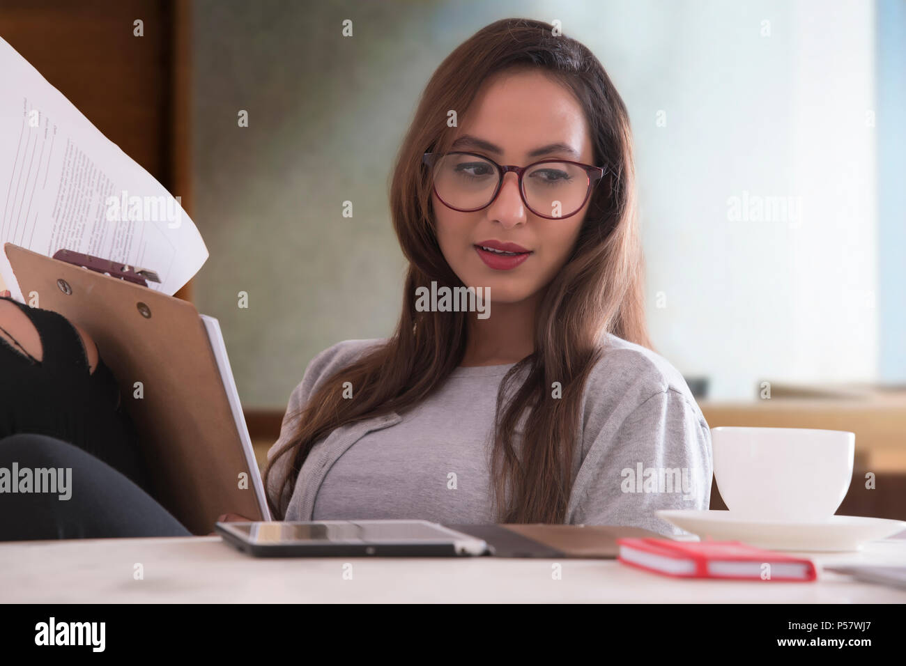 Indian women writing hi-res stock photography and images - Alamy