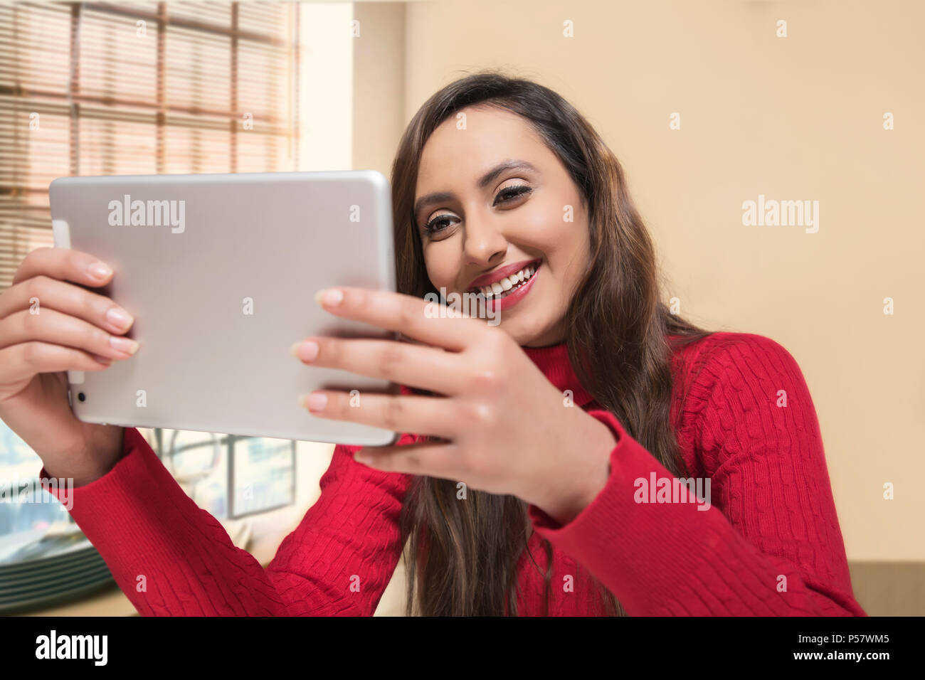 Young adult video tablet hi-res stock photography and images - Alamy