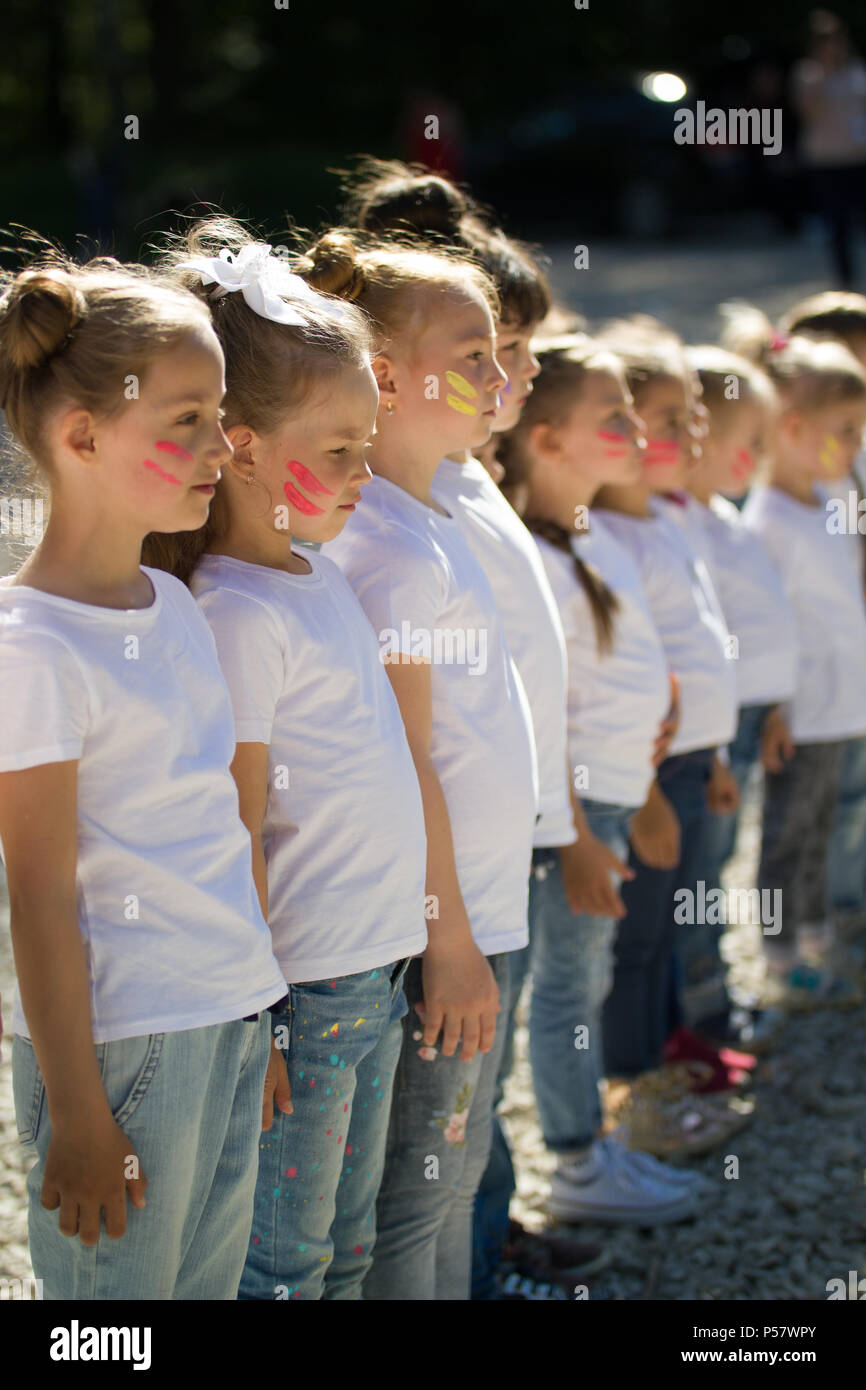Group of little children lined up in line outdoors in summer day Stock ...