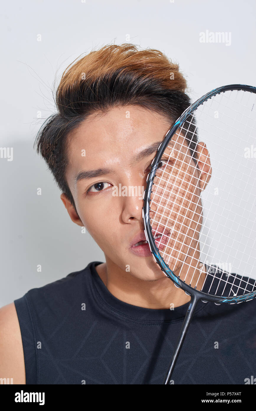 Man with badminton racket, portrait Stock Photo - Alamy