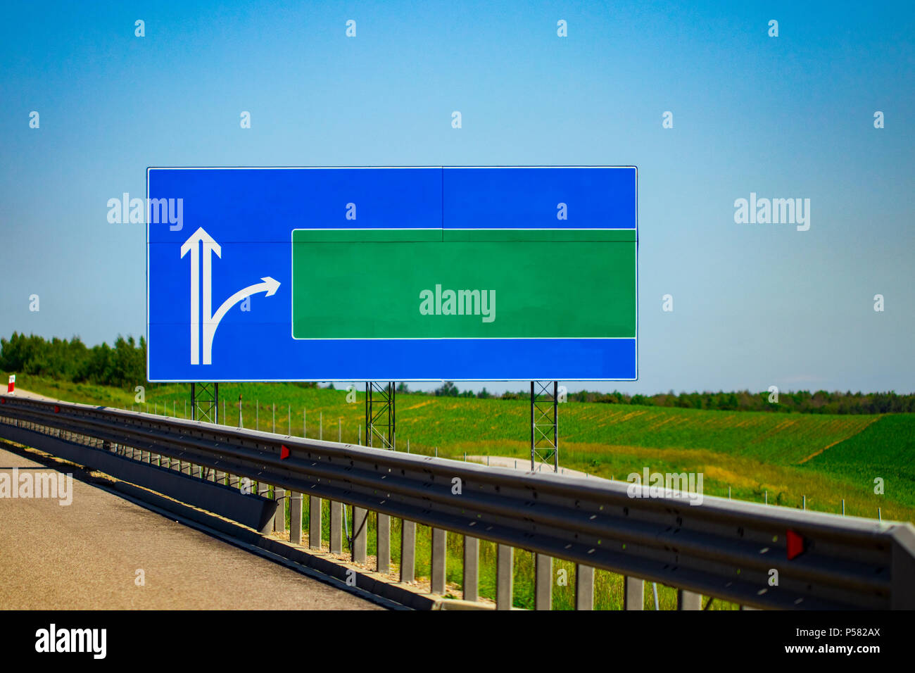 Big blank highway road sign with gradient blue sky Stock Photo - Alamy