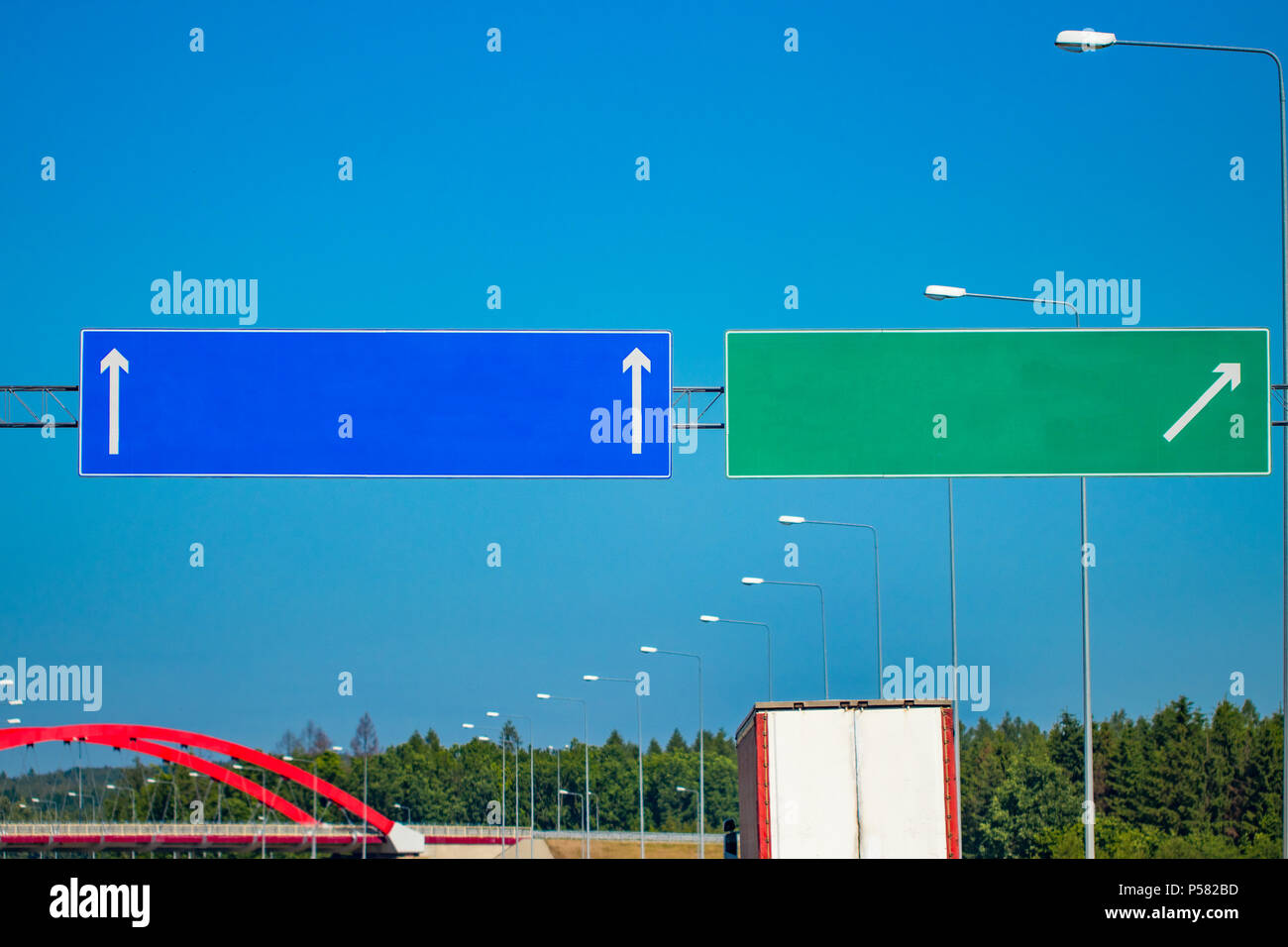 Big blank highway road sign with gradient blue sky Stock Photo - Alamy
