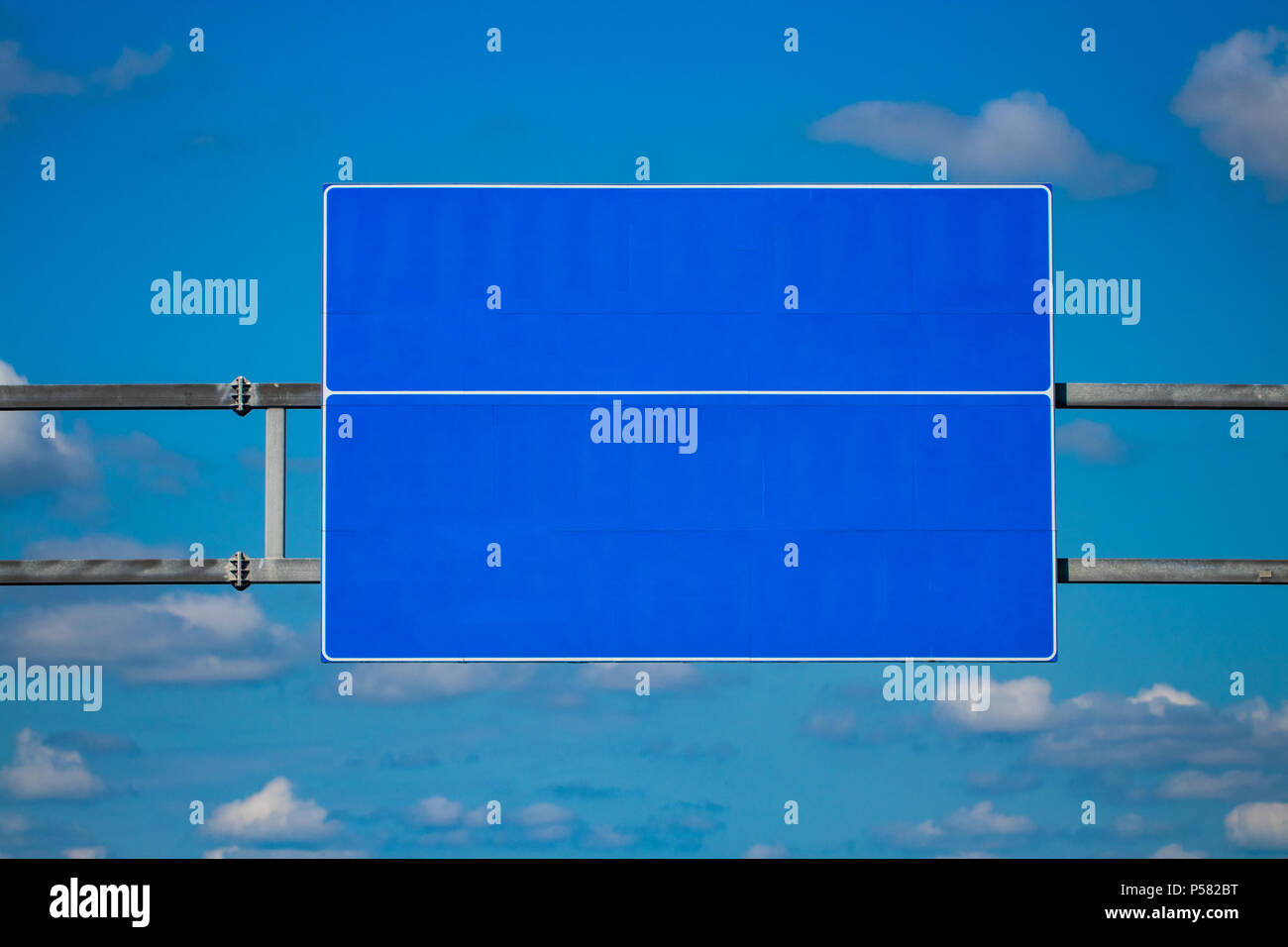 Big blank highway road sign with gradient blue sky Stock Photo - Alamy