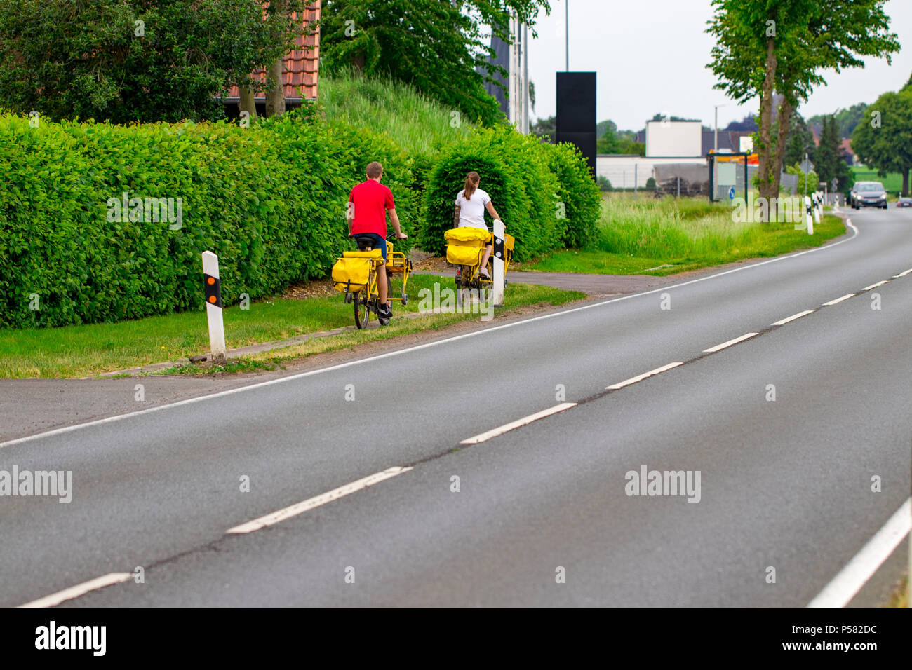 Postman riding bike hi-res stock photography and images - Alamy
