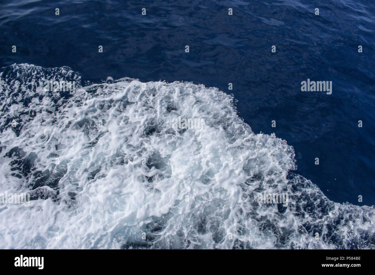 small waves and foam of sea water Stock Photo - Alamy