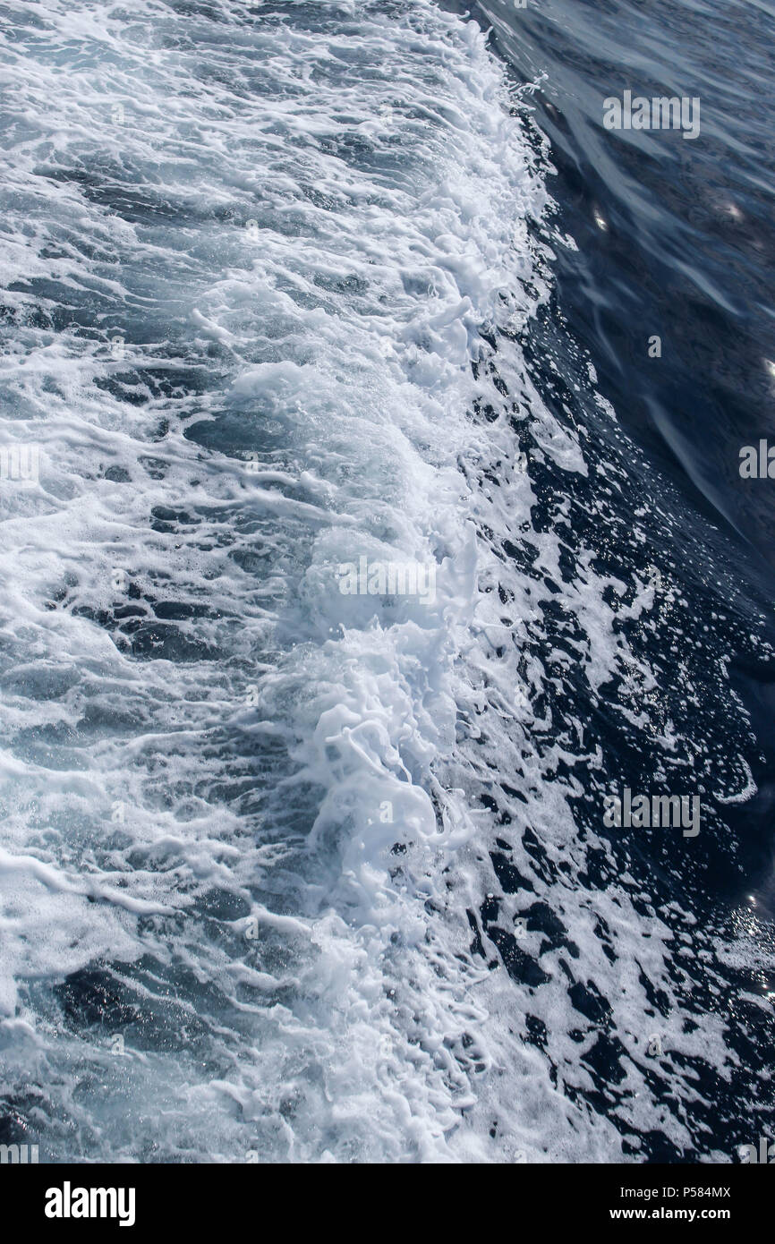 small waves and foam of sea water Stock Photo - Alamy