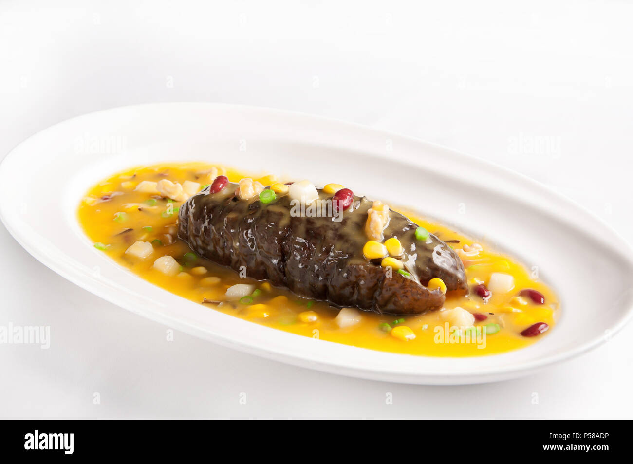 Chinese cuisine-Grain stewed sea cucumber Stock Photo - Alamy