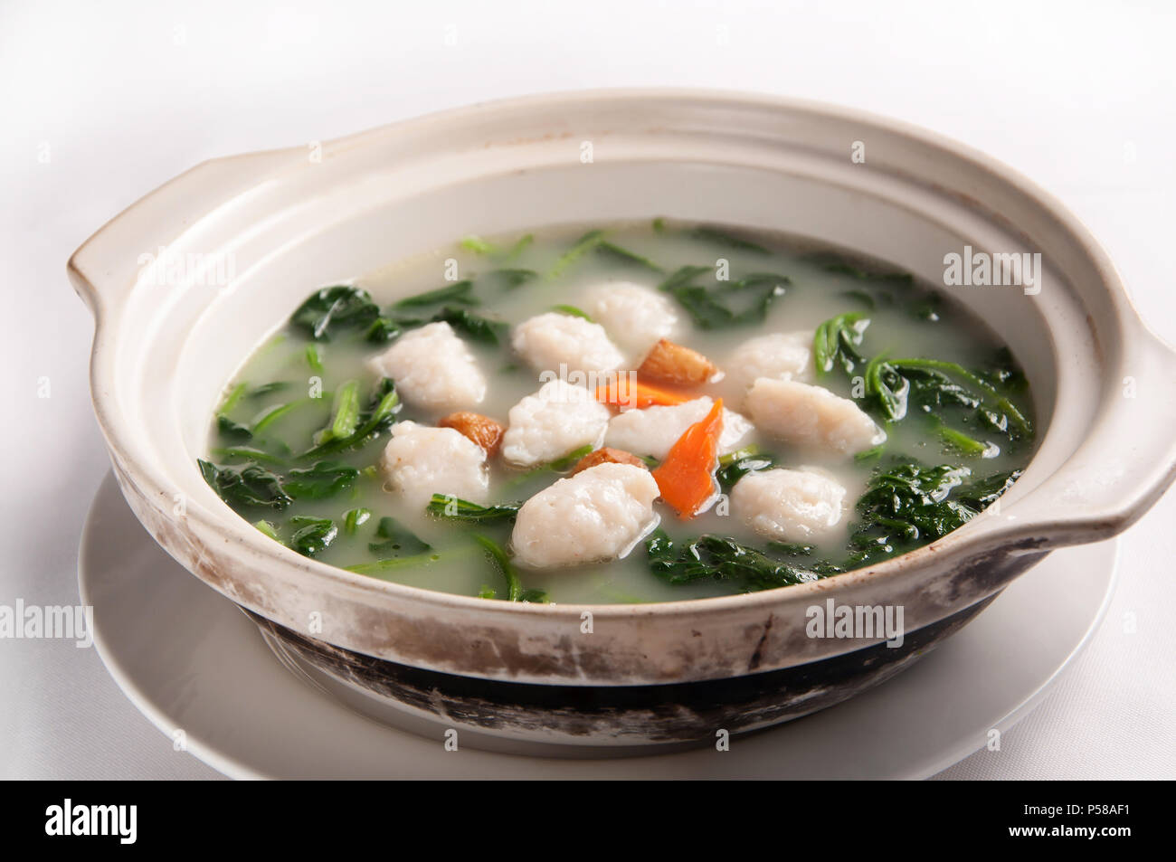 Chinese cuisine-The soup fish ball with Vegetables Stock Photo - Alamy