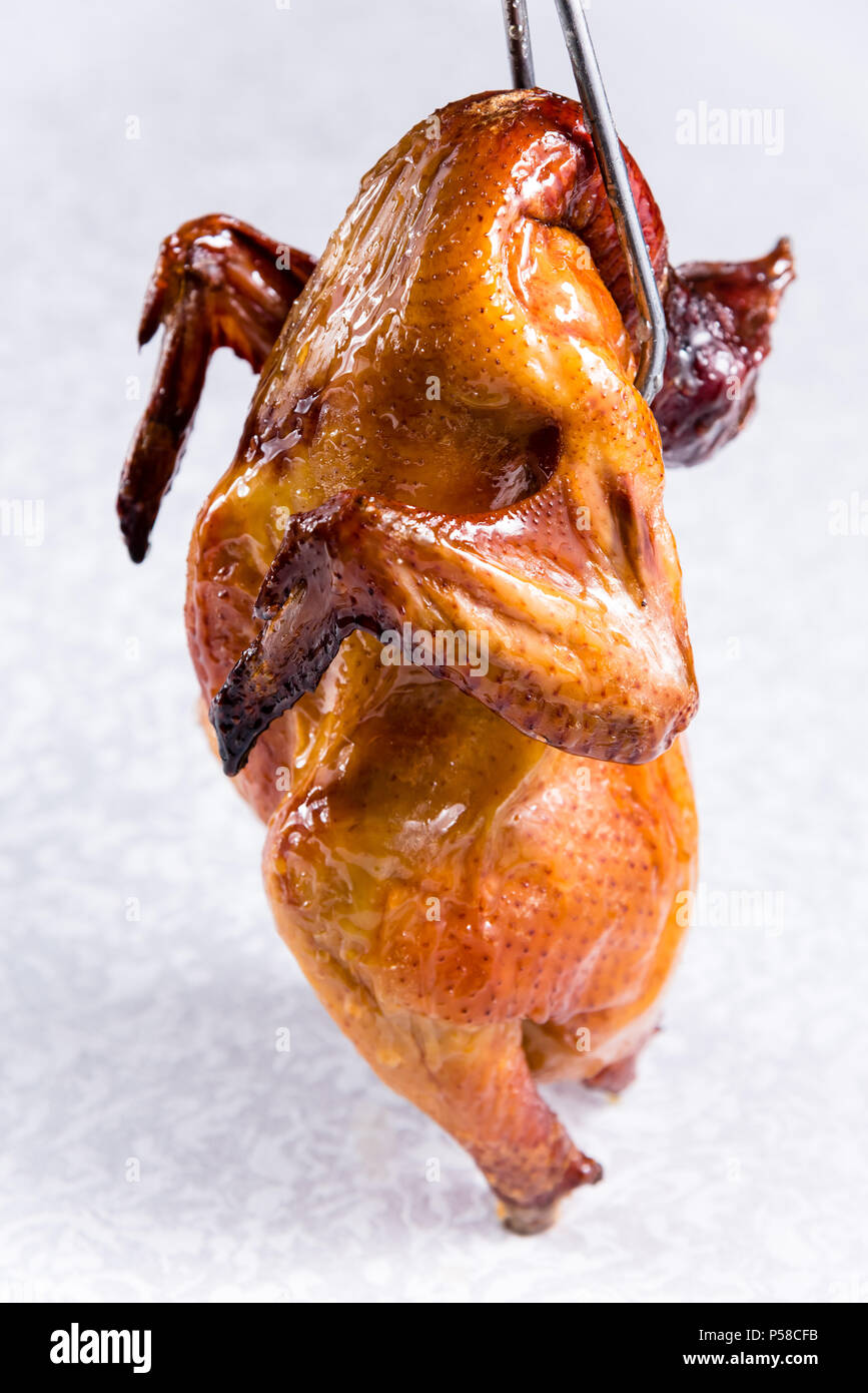 Hanging roast Chiken Stock Photo - Alamy