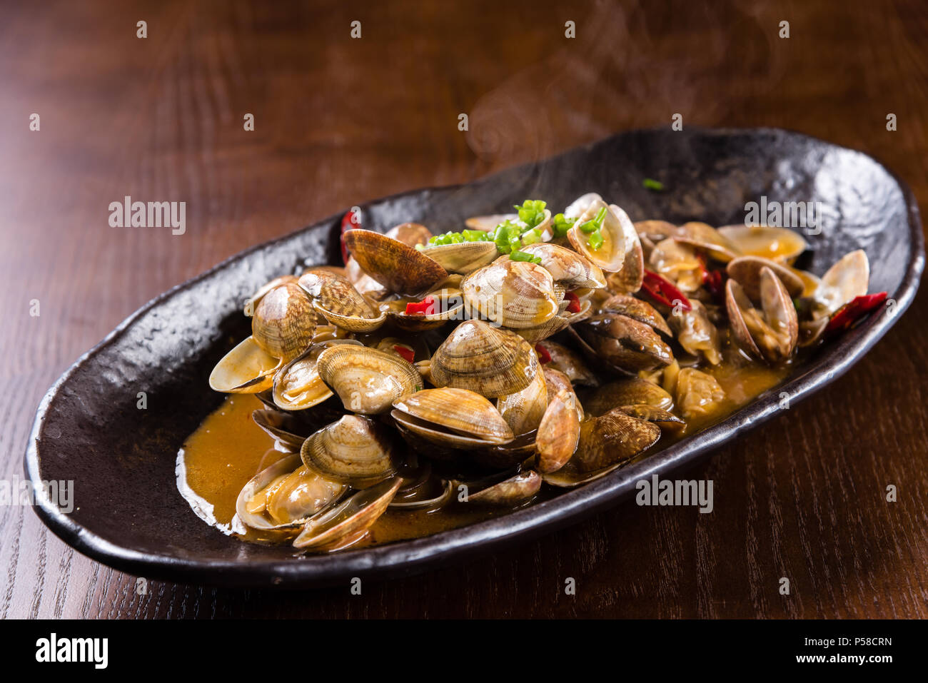 Spicy fried clams Stock Photo - Alamy