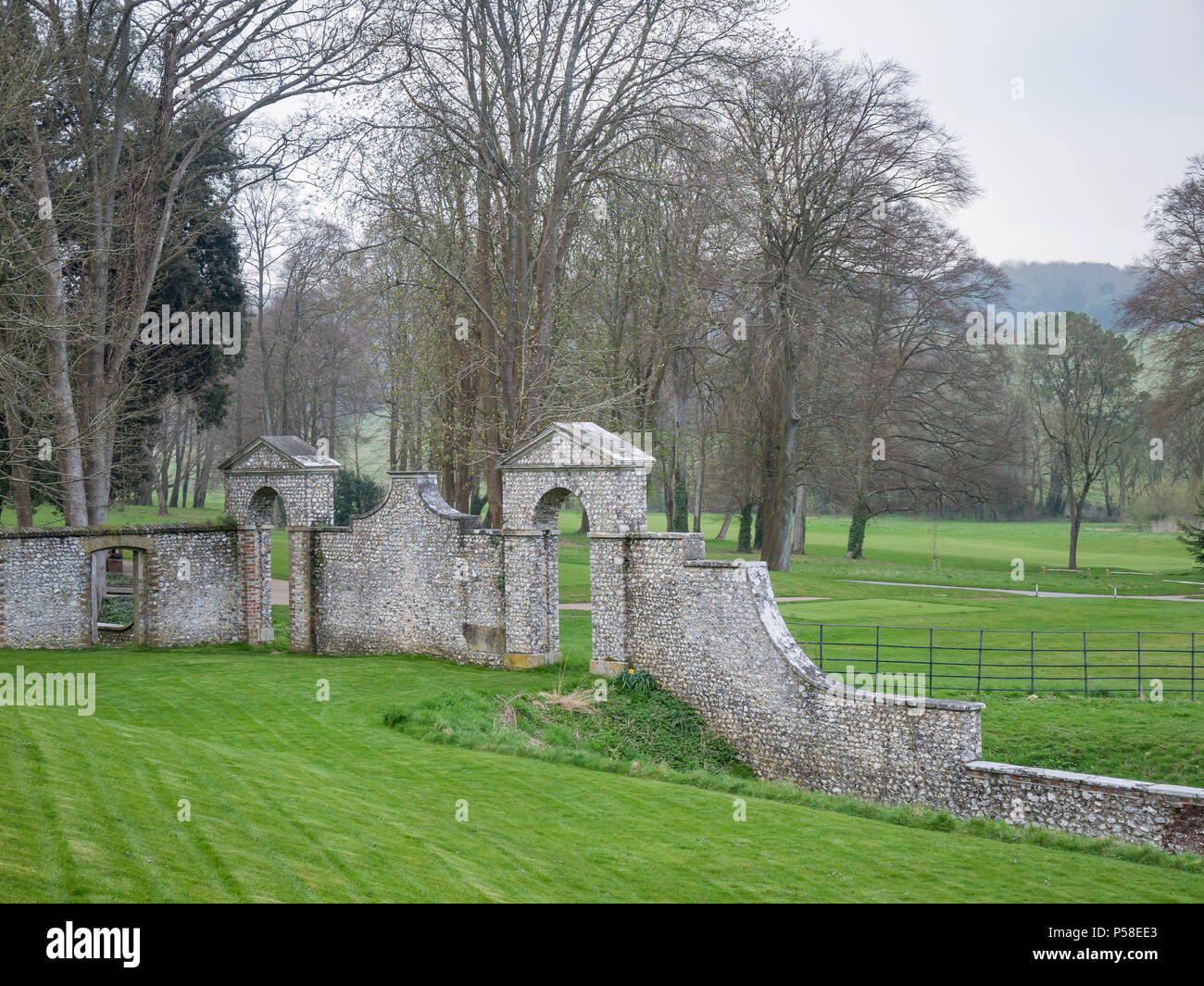 Country side view with a stone wall and gate at Chichester, United ...