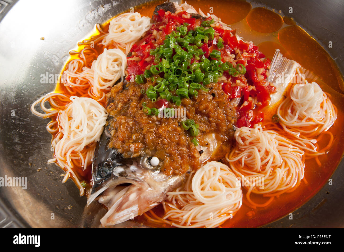 Steamed Fish Head with Diced Hot Red Peppers Stock Photo - Alamy