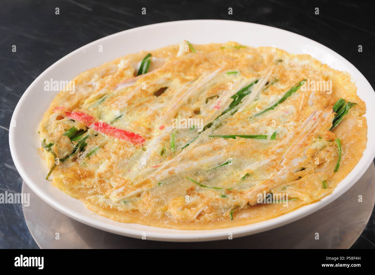 Korean cuisine - Seafood scallion cake Stock Photo - Alamy
