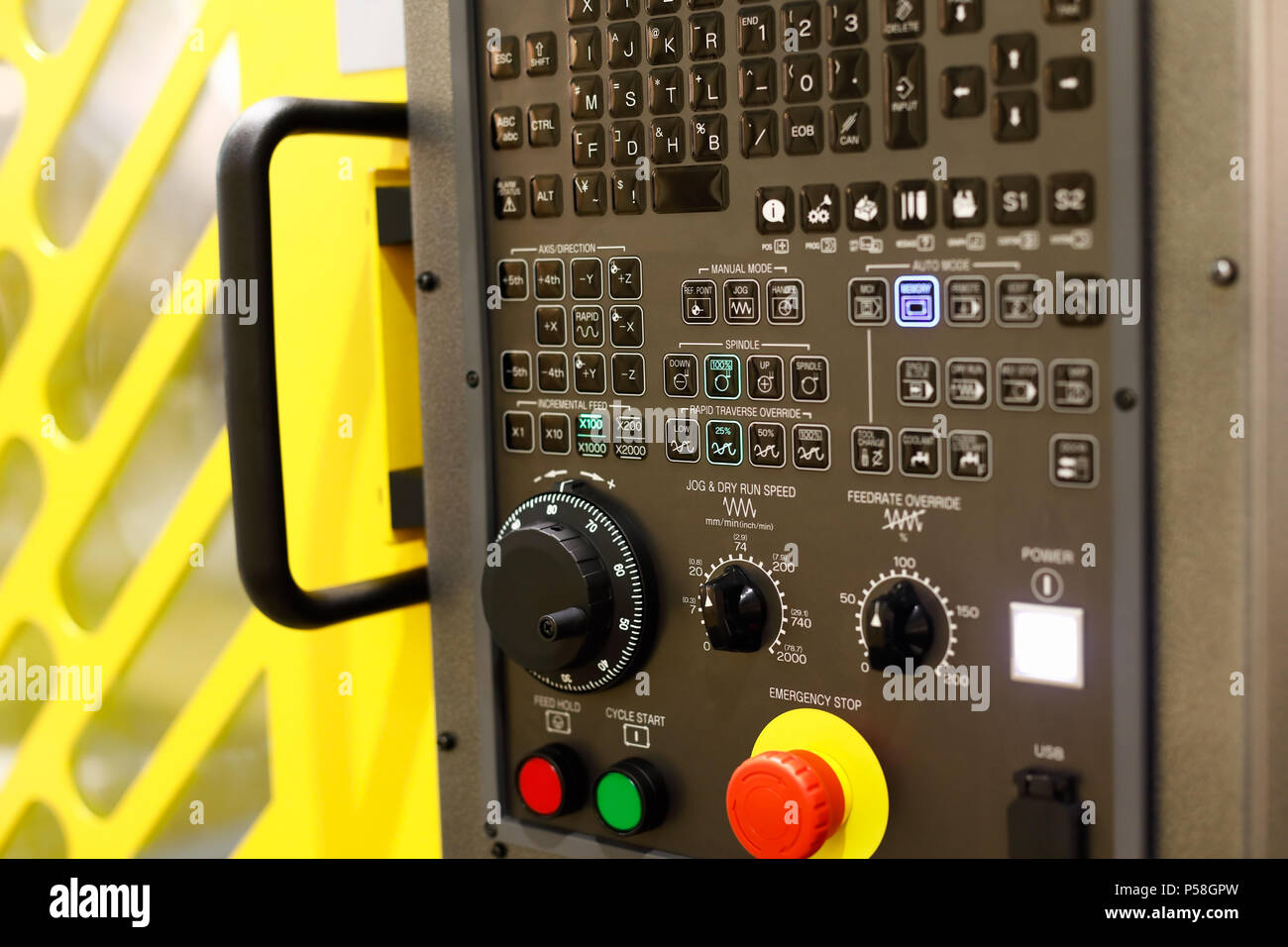 A control panel of modern 5-axis CNC lathe machine. Selective focus ...