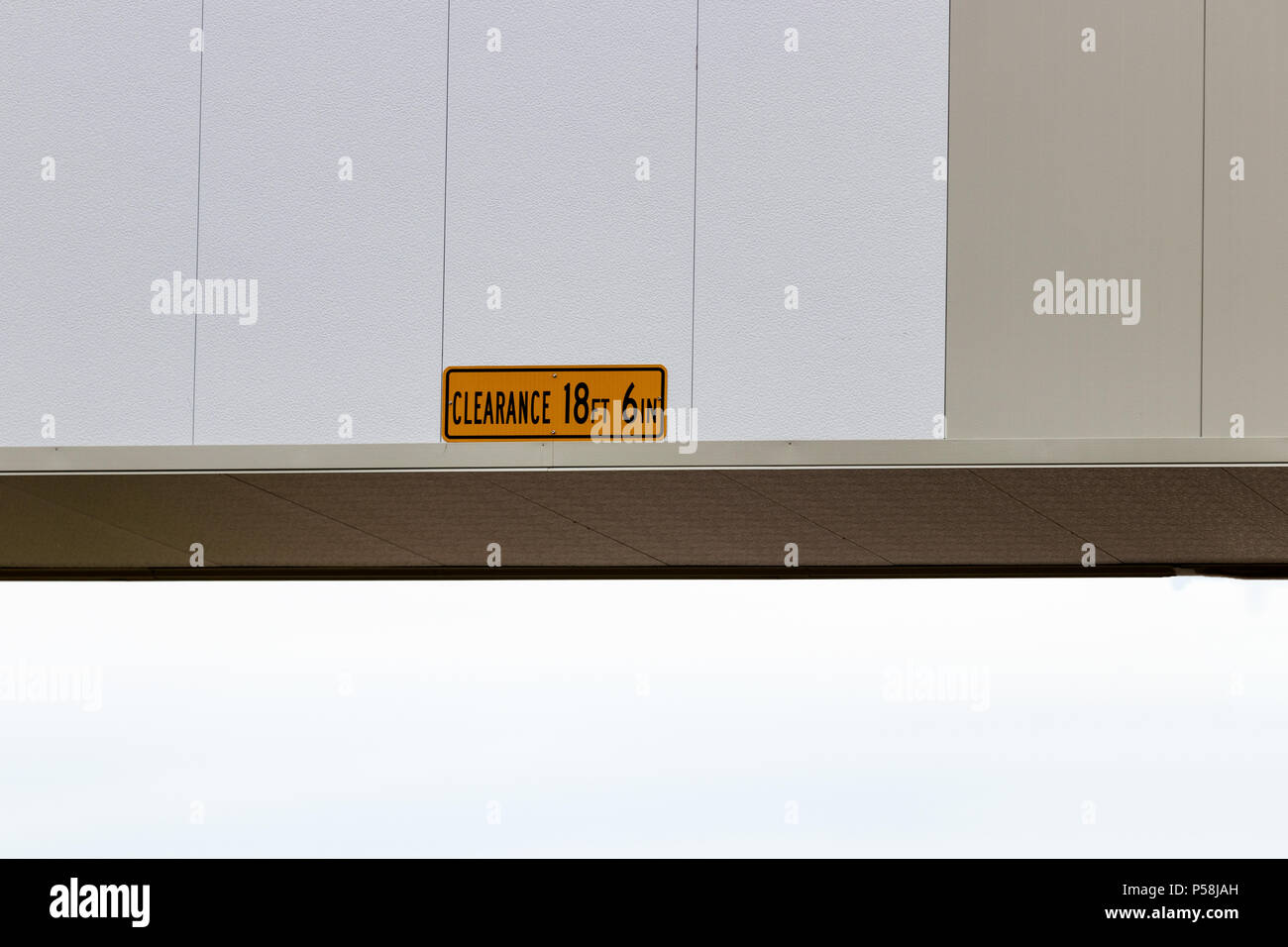 Low clearance sign on a white overpass 18 feet 6 inches Stock Photo - Alamy