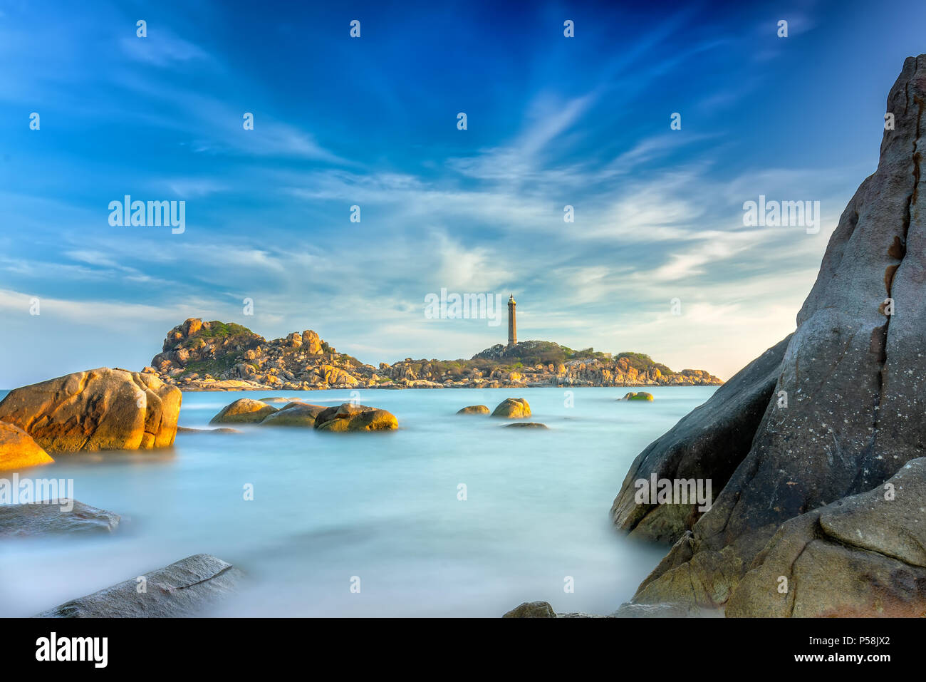 Ke Ga Lighthouse sunset with surf patted smoother reefs create clouds ...