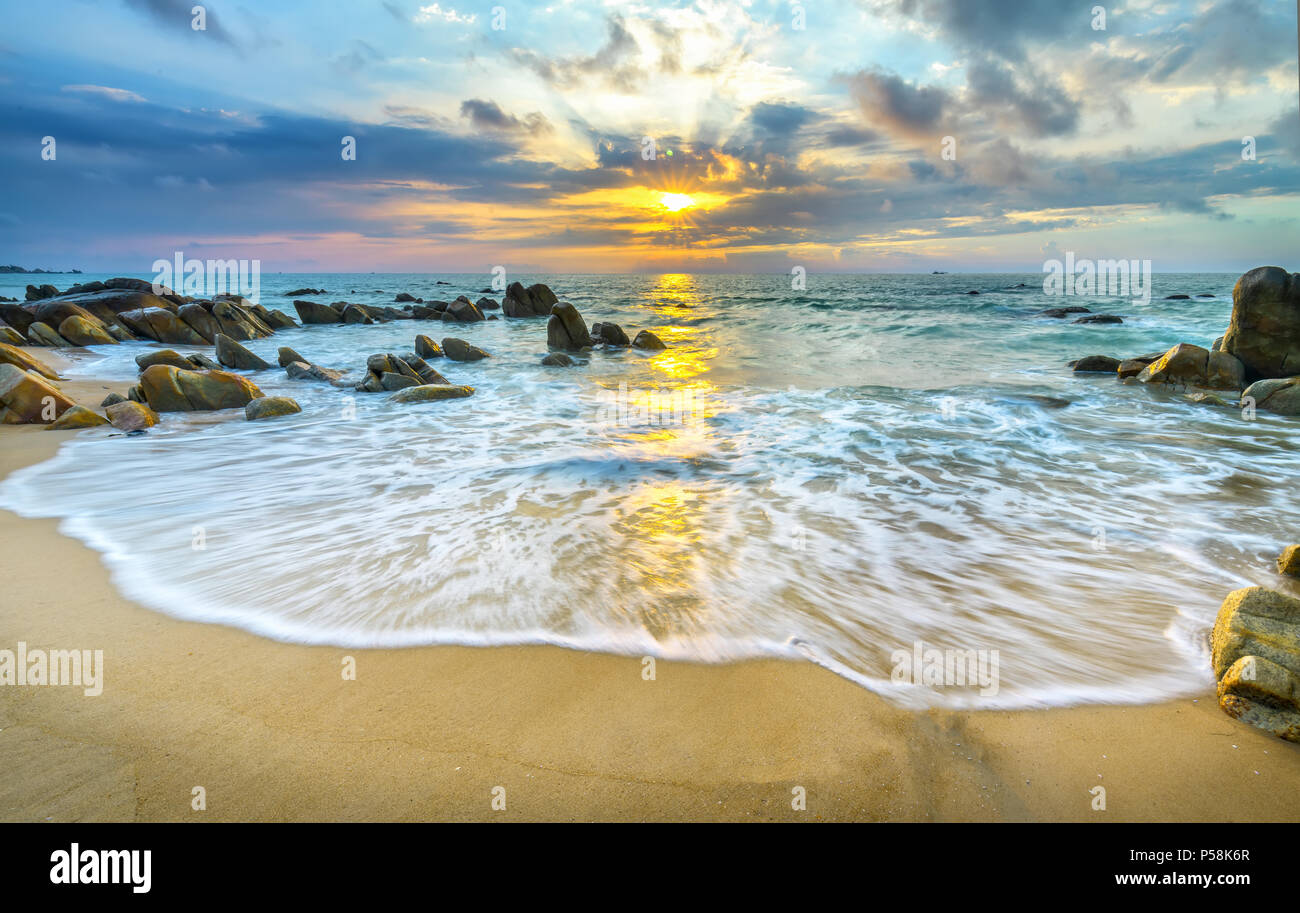 Dawn on beautiful beaches with white sand streaks waves like silk to ...