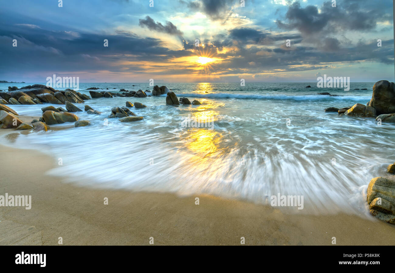 Dawn on beautiful beaches with white sand streaks waves like silk to ...