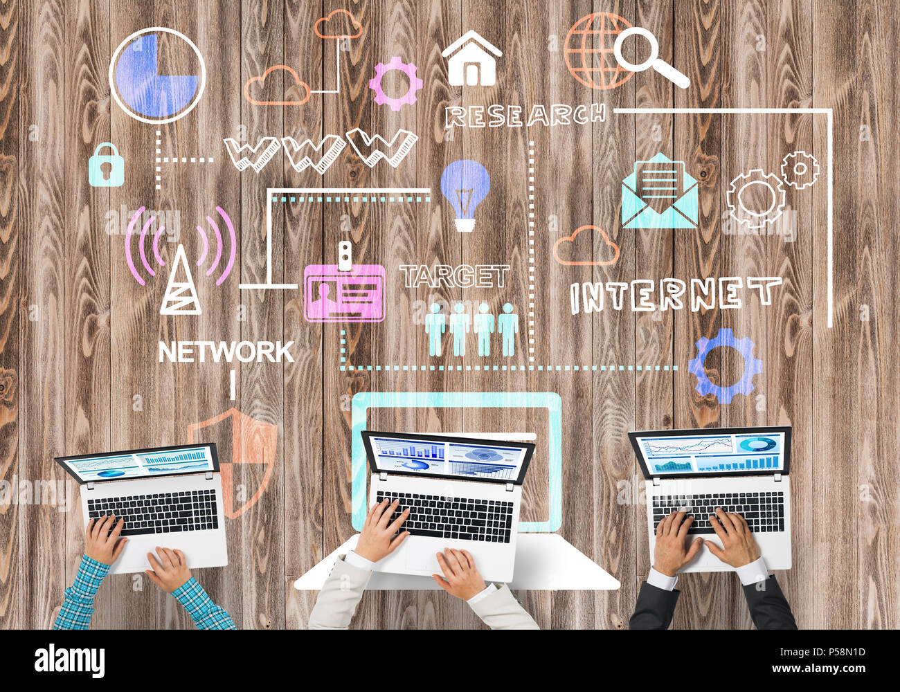 Group of three people with devices in hands working together as symbol ...