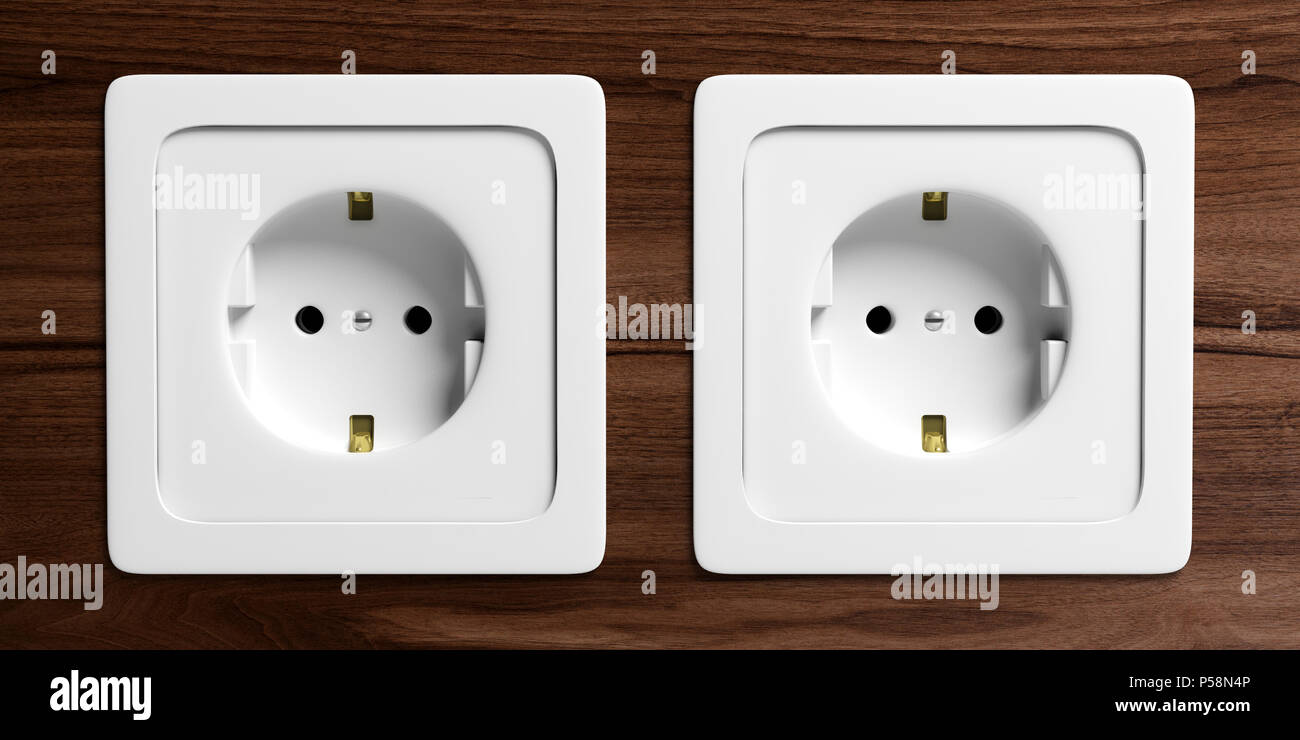 Two white electric power sockets isolated on wooden background, front ...
