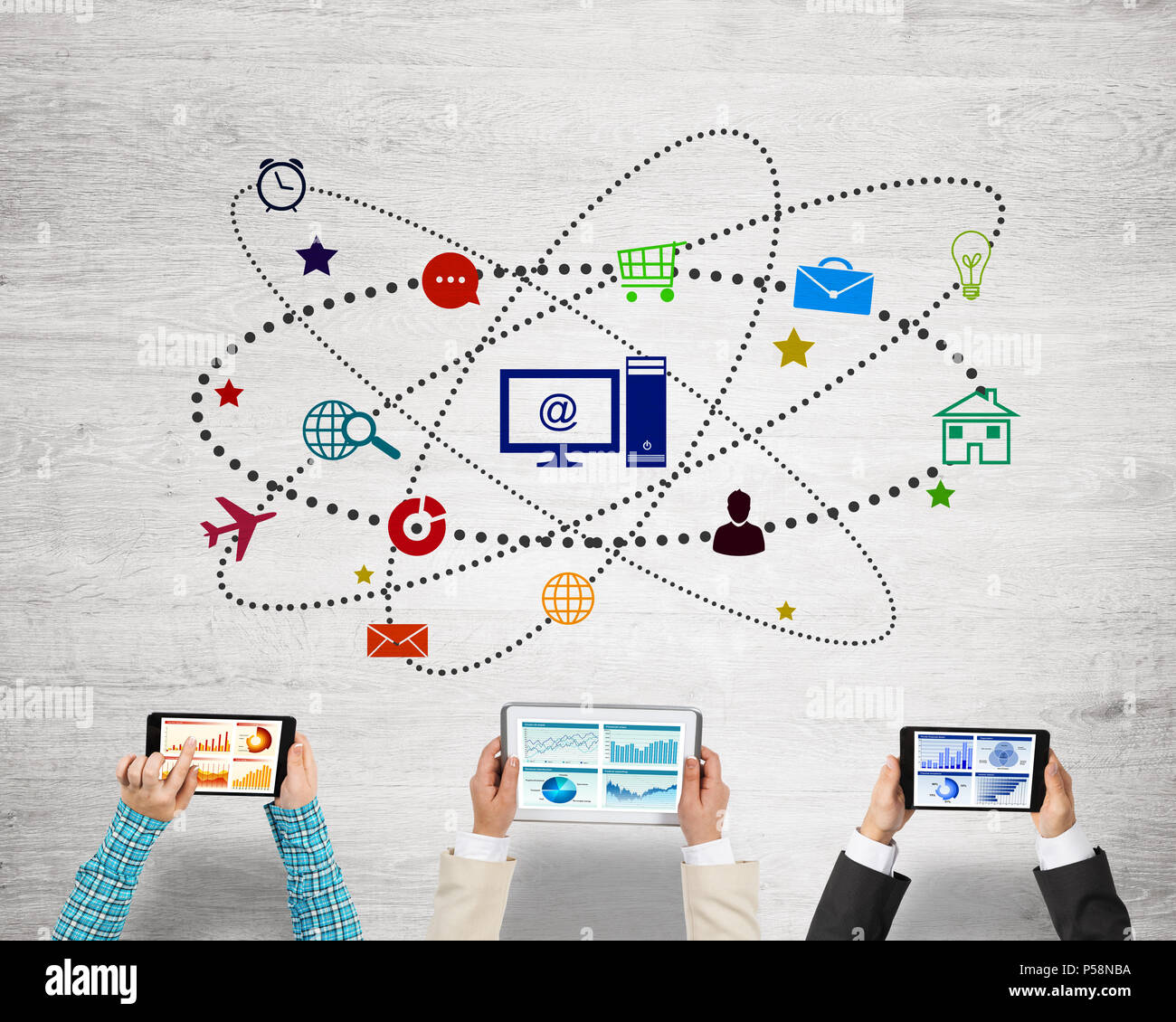 Group of three people with devices in hands working together as symbol ...