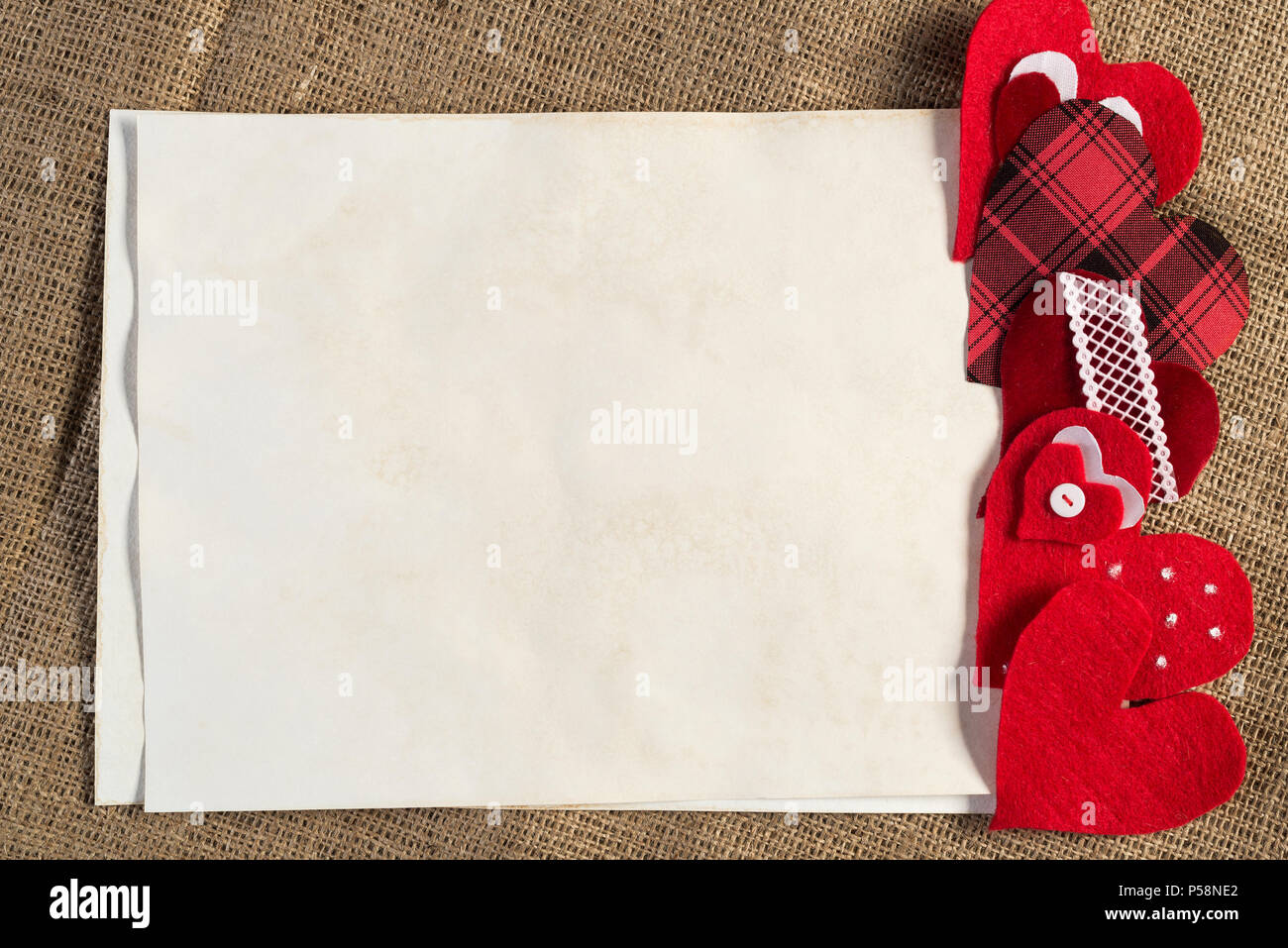 Handmade love hearts and sheets of blank paper Stock Photo - Alamy